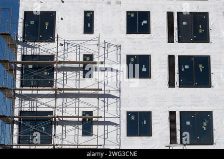 Energy efficient apartment building under construction, Downtown ...
