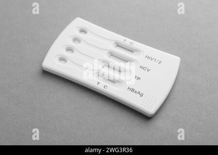 Disposable multi-infection express test kit on light blue background ...