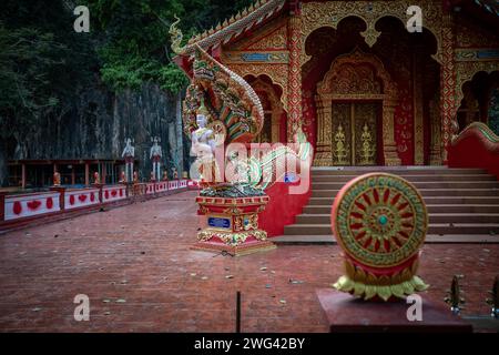 A red temple at the Wat Tham Pla Temple. Wat Tham Pla (Cave Fish Temple ...
