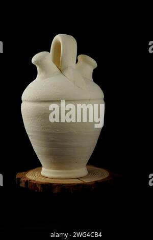 Handmade clay botijo isolated on black background Stock Photo - Alamy