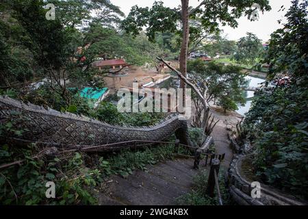 Dragon stairs leading to a cave at the Wat Tham Pla Temple. Wat Tham ...