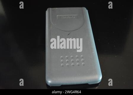 A gray calculator made of quality plastic with beautiful colors located ...