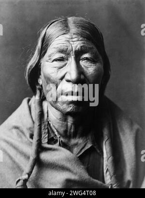 Cheyenne male, facing front, hair in wrapped braids, blanket around ...