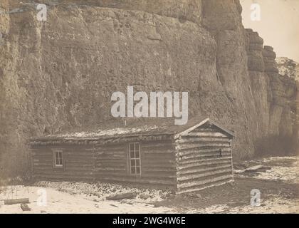 Camp Curtis, 1908. Photograph shows log cabin in clearing in front of a ...