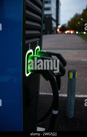 Two charging handles of an electric car charger Stock Photo - Alamy