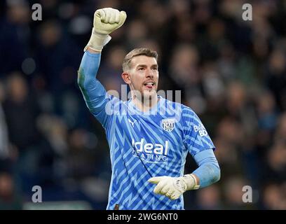 West Bromwich Albion goalkeeper Alex Palmer punches the ball clear ...