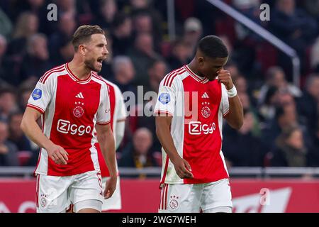 AMSTERDAM - (l-r) Jorrel Hato of Ajax, Jordan Henderson of Ajax ...