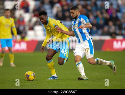 Anthony Musaba of Sheffield Wednesday is under pressure from Brodie ...