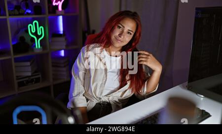 Young redhead woman streamer smiling confident sitting on table at ...