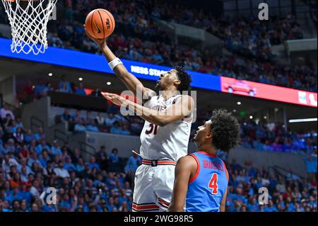 Auburn guard Chaney Johnson (31) dribbles against Mississippi forward ...