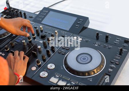 Close-up of a dj operating Sound mixer on a table Stock Photo - Alamy