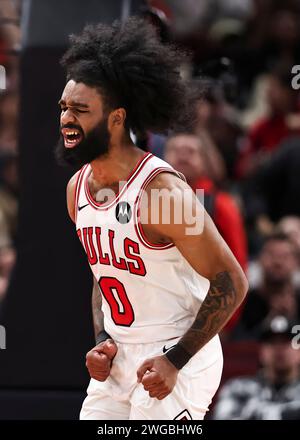 Chicago Bulls guard Coby White drives between Phoenix Suns center Oso ...