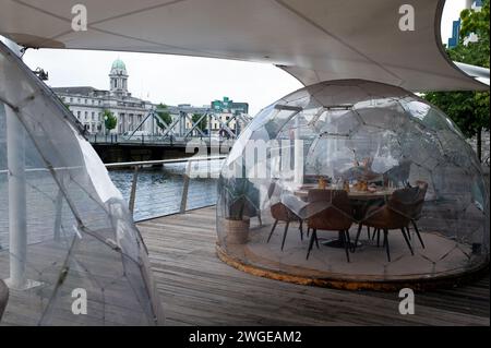 Restaurant tables in domes in Boardwalk Lapps Quay, Cork Stock Photo ...