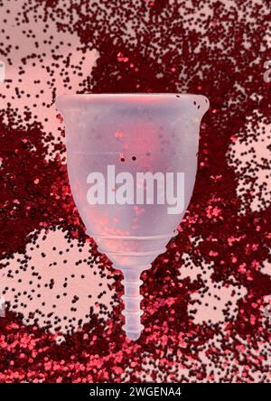 Menstrual Cup with red glitter on white background, concept of women's ...