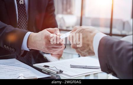 The concept of exchanging business cards between colleagues Stock Photo ...