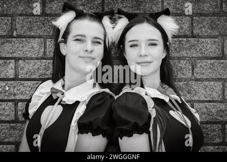 A grayscale portrait of two cosplay girls dressed as Japanese Maids ...
