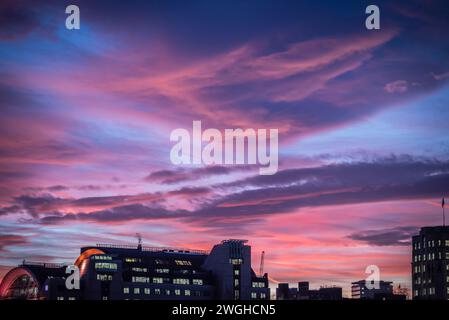 London skyline from Watrloo Bridge with pink and purple sky, London ...
