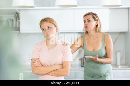 Angry mother yells at teenage girl sad daughter Stock Photo - Alamy