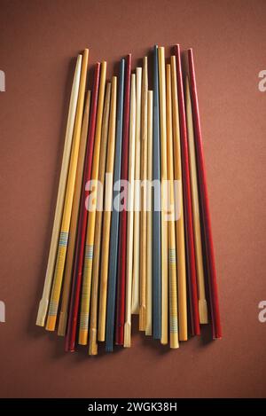 Many Asian wooden chopsticks arranged in a row background. Lots of ...