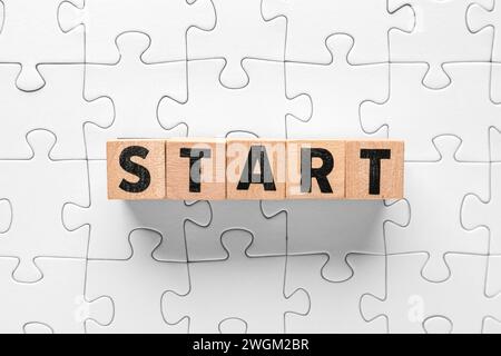 Cubes with word STARTUP and puzzle pieces on grey background Stock ...