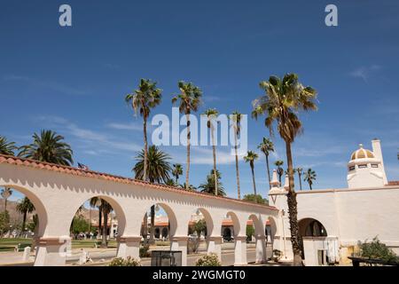 Palm framed daytime view of historic buildings in downtown Ajo, Arizona ...