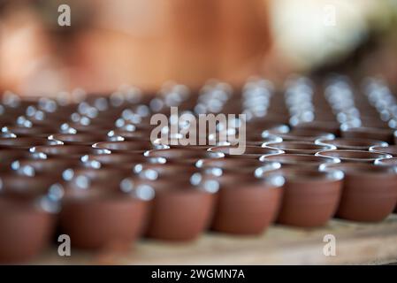 Neatly stacked clay embryos and molds in a traditional Chinese pottery ...