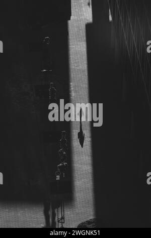 Person walks in the light casting a shadow Stock Photo - Alamy