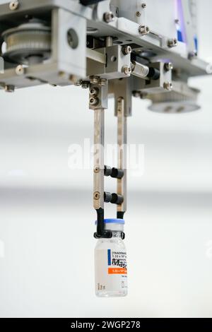 Mannheim, Germany. 06th Feb, 2024. An employee holds a vial containing ...