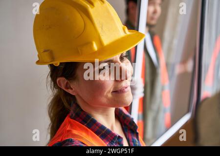 female window installer Stock Photo - Alamy