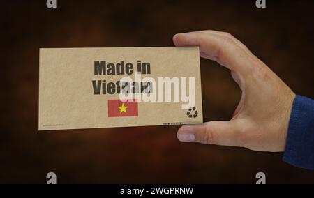 Made in Vietnam box in hand. Manufacturing and delivery. Product ...