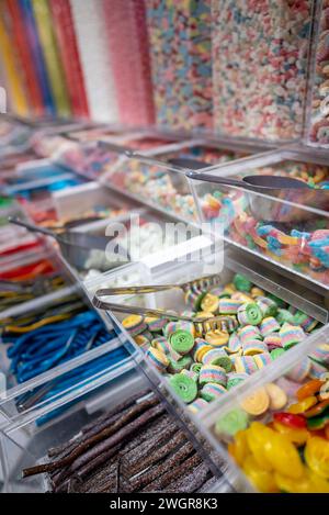 showcase of candy shop, transparent container with various sweets ...