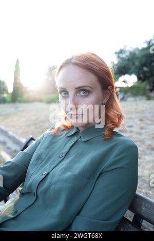 Portrait of young woman with red hair and a tan shirt Stock Photo - Alamy