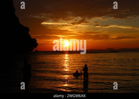 beautiful sunset from railay beach, princess cave in krabi in thailand ...
