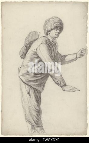 Standing man with fur hat and pack on the back Stock Photo - Alamy