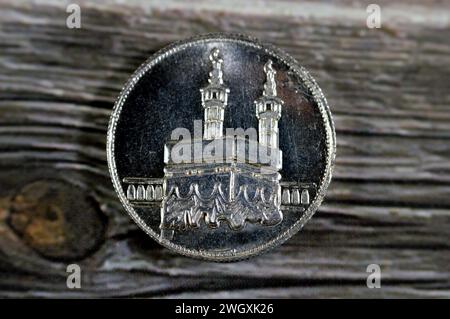 An Islamic pound coin of pure precious silver metal features Kaaba and ...