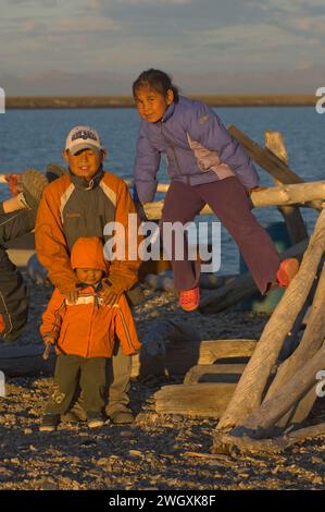 Eskimo Inupiat kids playing at camp on a sandspit along Demarcation bay ...