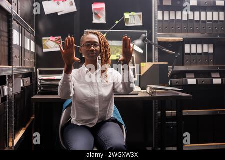 Law enforcement investigator using ar technology to analyze crime scene ...