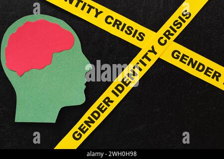 Human head profile with word gender identity crisis in dark black ...