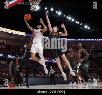 Oklahoma State guard Connor Dow, left, and Kansas guard Dajuan Harris ...