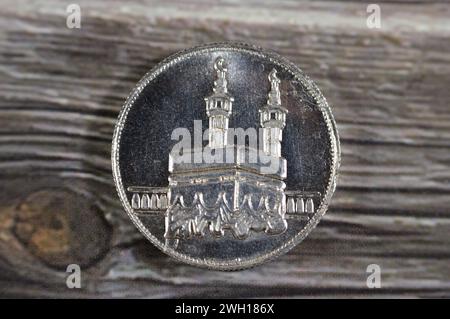 An Islamic pound coin of pure precious silver metal features Kaaba and ...