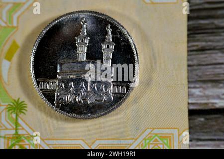 An Islamic pound coin of pure precious silver metal features Kaaba and ...