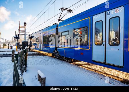 Wintertime in the village. A road running through a snowcapped town in ...