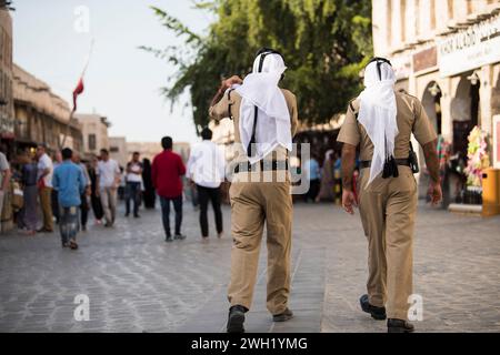 Doha, Qatar-December 16,2023 : Police in traditional dress on front of ...