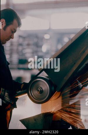 Handyman working at Bieffe design steel furniture factory, Caselle ...