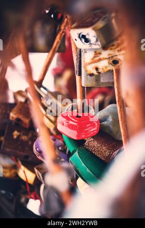 Heart shaped padlock among many old rusty locks Stock Photo - Alamy
