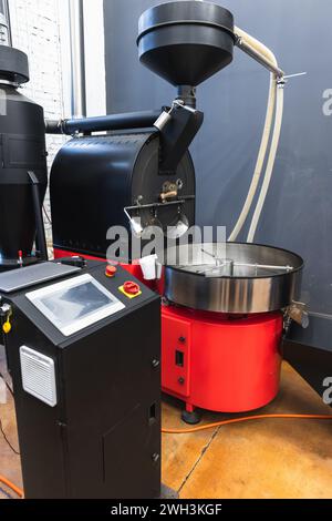 Coffee roaster in a coffeehouse, vertical photo of industrial roastery ...