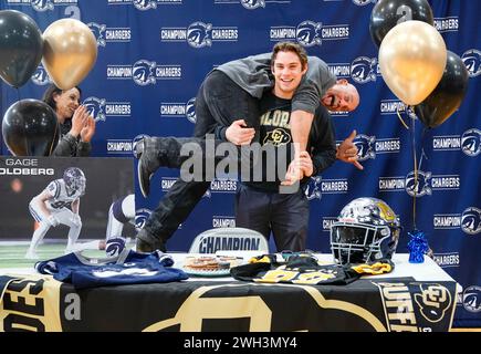 Wrestling Hall of Famer BILL GOLDBERG is lifted up by his son GAGE ...