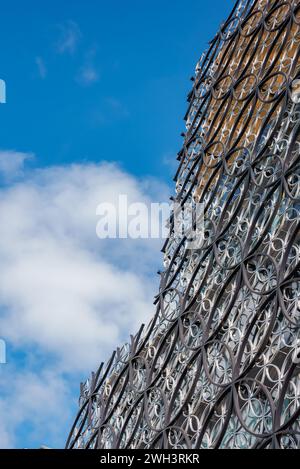 A circular design featuring a geometric pattern with bold red and green ...