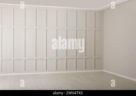 Empty room with beige walls and laminated flooring Stock Photo - Alamy