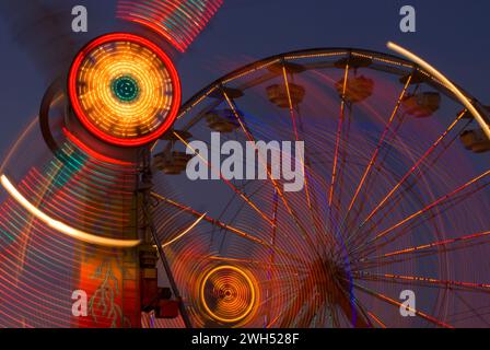 Kamikaze and Sinbad carnival rides with ferris wheel, Oregon State Fair ...